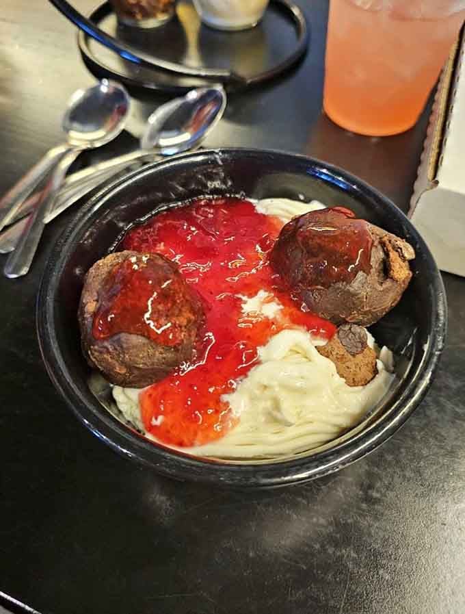Spaghetti ice cream with strawberry sauce looks bizarre but tastes like childhood joy in a bowl.