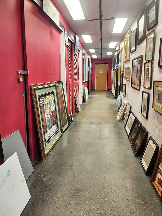 Framed art lines the hallway like a gallery opening where everything's actually affordable and going home with you.