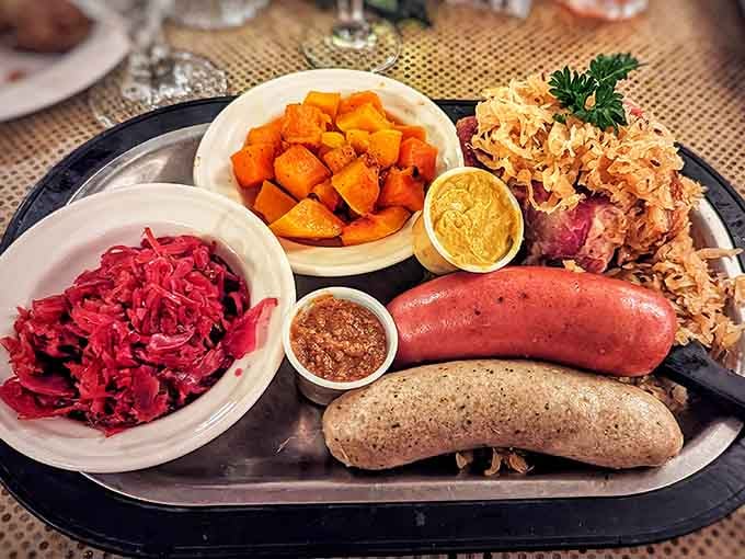 The sausage platter arrives like the United Nations of German meat craftsmanship, complete with sauerkraut and potato salad diplomacy.