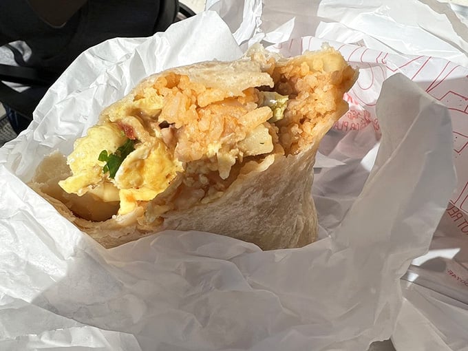 A breakfast burrito so perfectly wrapped it almost seems a shame to unwrap it, but your stomach won't forgive hesitation.