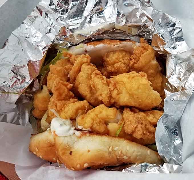 That fish sandwich is loaded with enough crispy goodness to make you temporarily forget you came here for hot dogs.