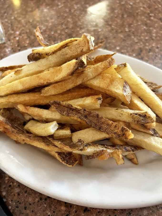 These aren't just fries; they're supporting actors that deserve their own Oscar. Crispy outside, fluffy inside&mdash;potato perfection.