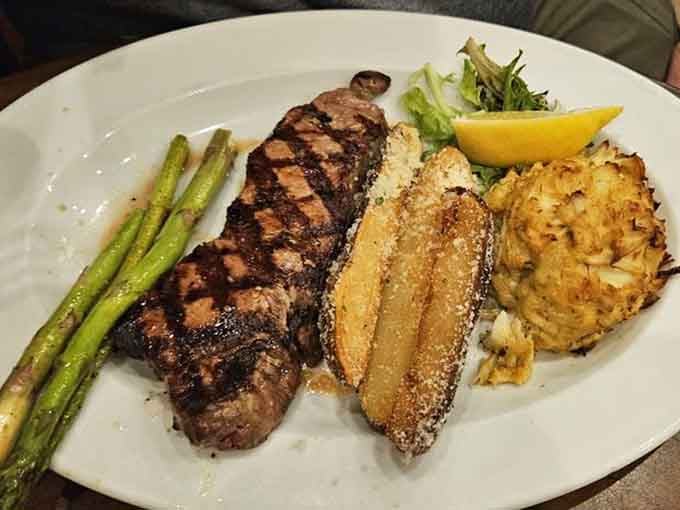 That perfectly charred steak paired with a golden crab cake defines surf and turf excellence.