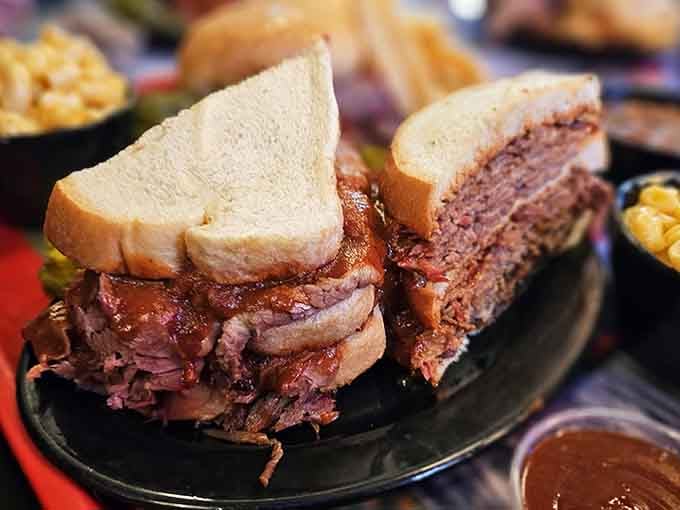 This towering sandwich masterpiece proves that sometimes the best things in life require both hands and zero shame.