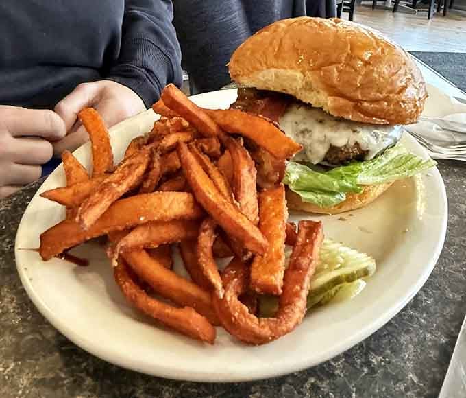 That burger and those sweet potato fries aren't messing around&mdash;this is serious comfort food with a coastal attitude.