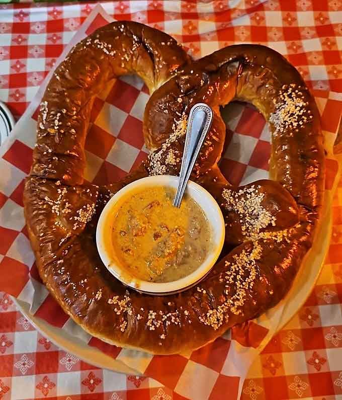 A giant pretzel with cheese sauce that's basically a warm, doughy hug for your taste buds and soul.