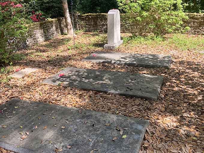 These weathered stones mark final resting places, each one representing a life lived in a very different South Carolina.