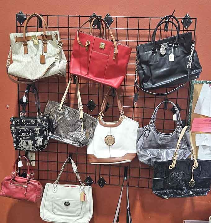 The handbag wall showcases everything from Coach to no-name classics, a leather and vinyl museum of fashion history.