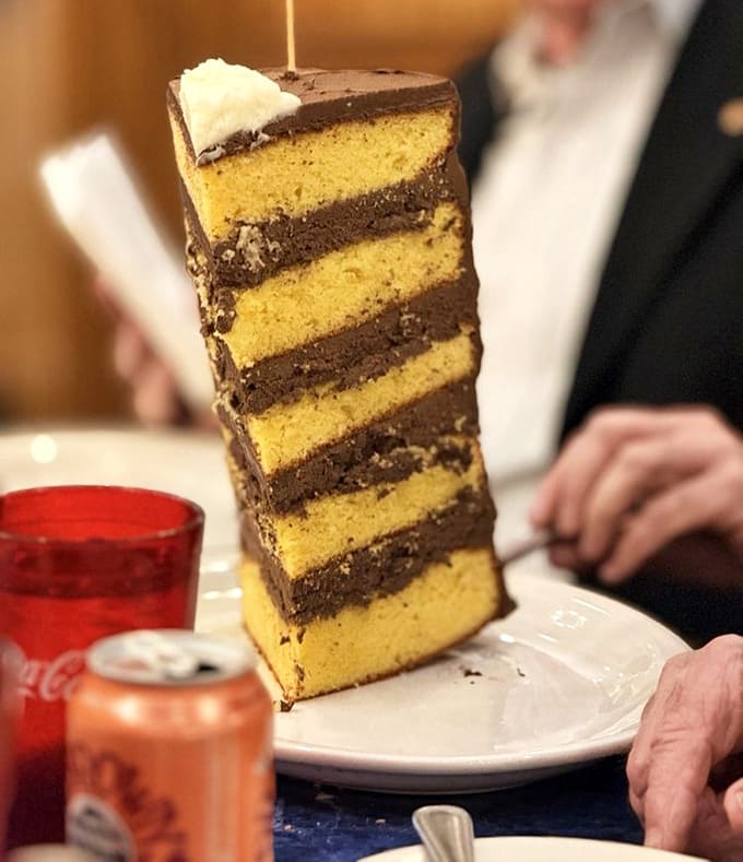 This towering cake slice defies gravity and common sense in the most wonderful way possible.