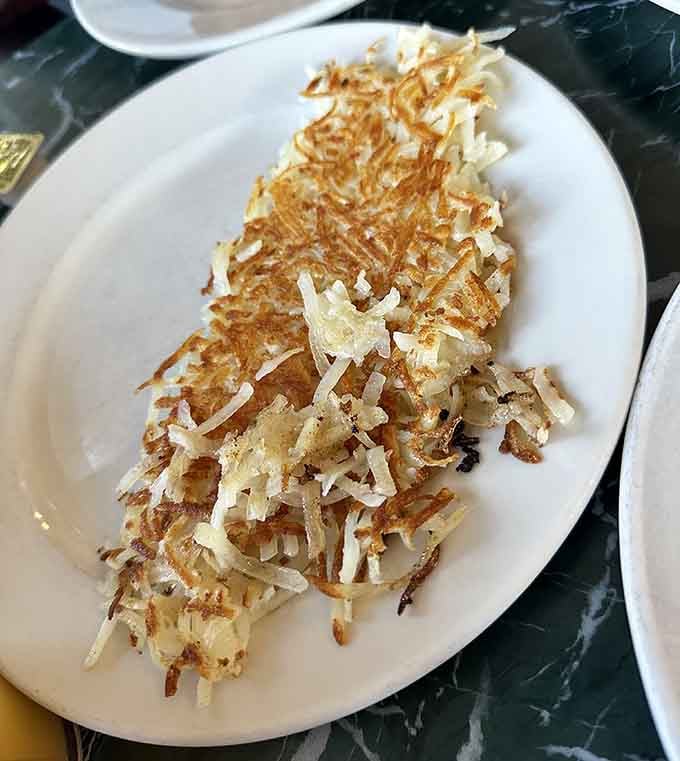 Hash browns cooked to golden perfection, crispy outside and tender inside, proving that simple done right beats fancy done wrong every time.