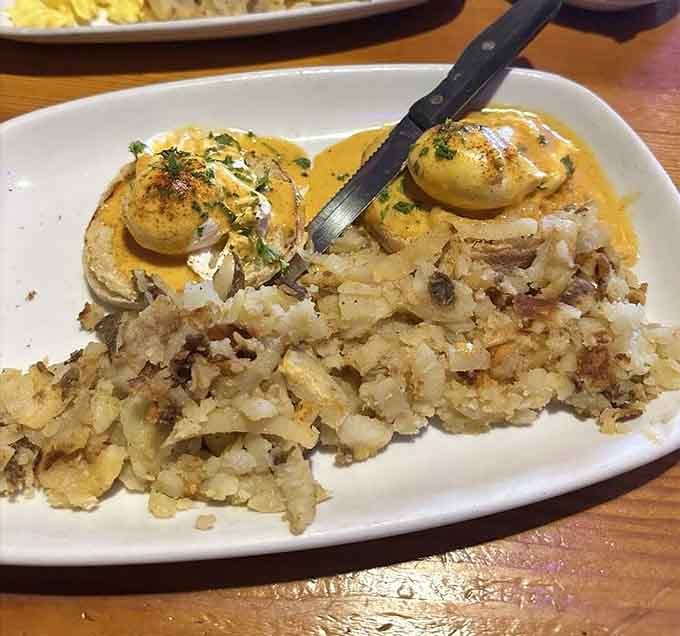 Eggs Benedict perched atop perfectly crispy hash browns is the kind of breakfast that makes you reconsider all your life choices.