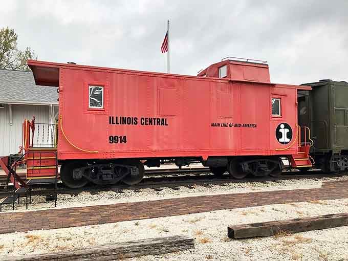 The Illinois Central caboose #9914 proudly displays its heritage as the "Main Line of Mid-America," a rolling office for crews of yesteryear.
