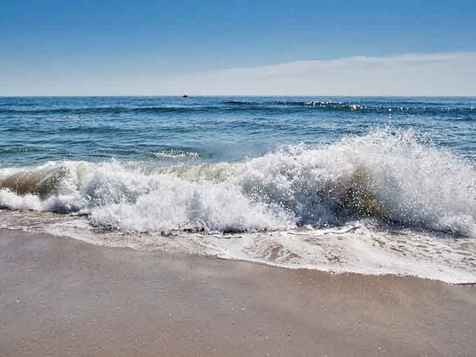 Waves that remind you the Atlantic Ocean has been doing this long before boardwalks existed.
