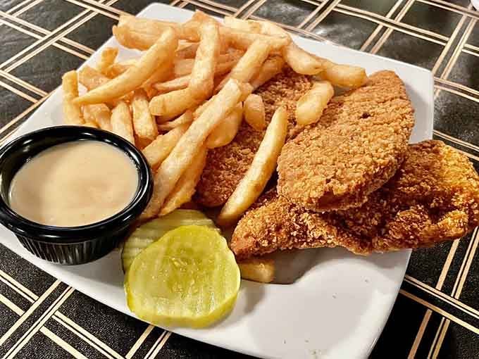 Golden chicken tenders and crispy fries prove that sometimes the classics don't need reinventing, just proper execution.