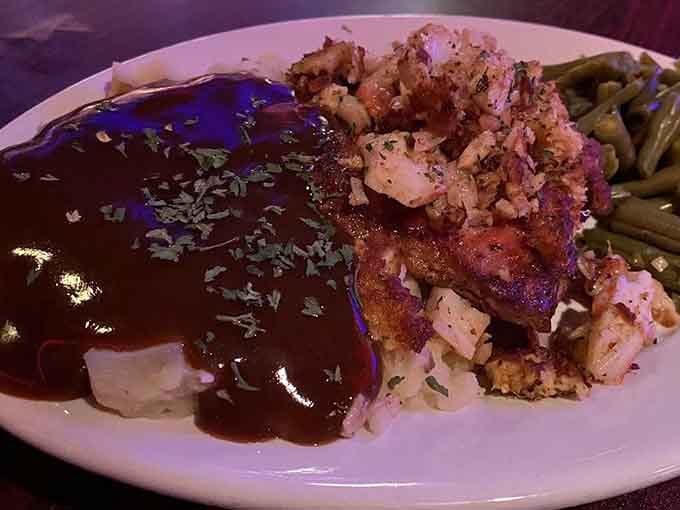 Pork chop stuffed with crab is the kind of surf-and-turf creativity that keeps a menu interesting for decades.