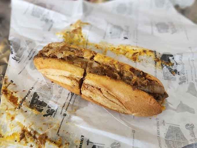 Golden bread cradling seasoned beef and onions, this is what dreams look like when they're wrapped in wax paper.
