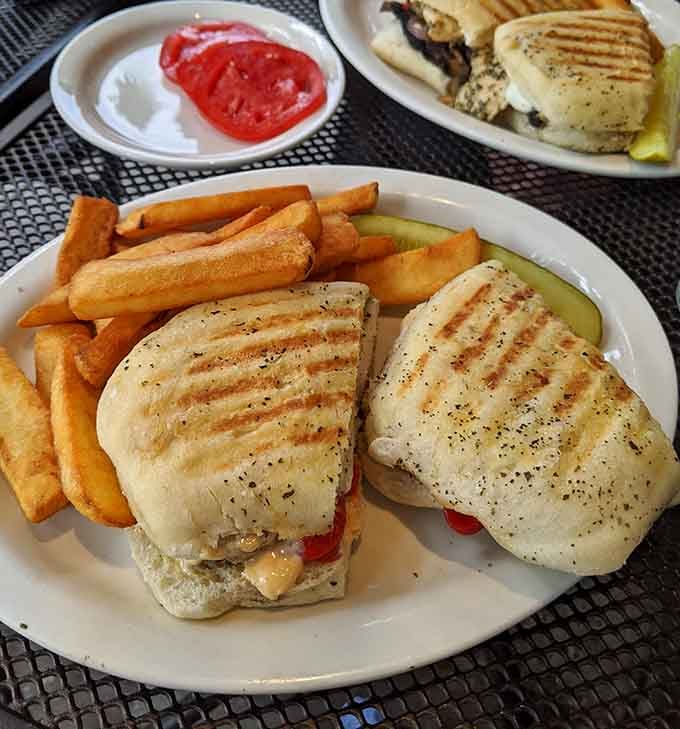 Grilled panini perfection with fries that could make you forget about your low-carb resolutions entirely.