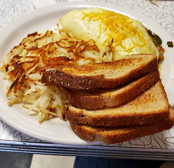 A Western omelet with hash browns and toast, because sometimes breakfast is the only meal that makes sense.