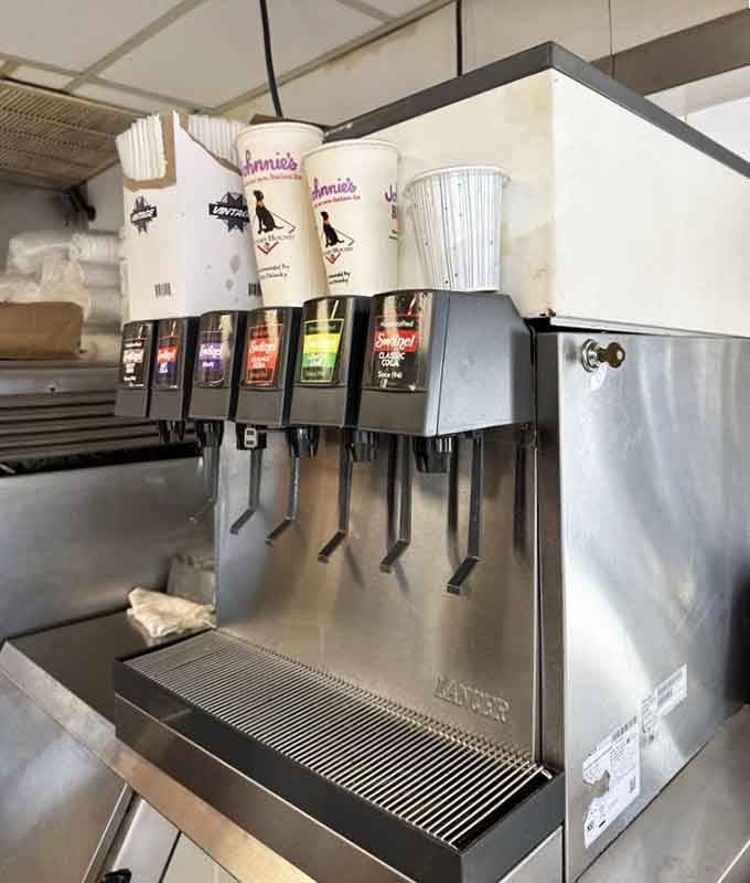 The soda fountain stands ready, a simple pleasure that never goes out of style no matter the decade.