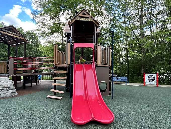 The clubhouse slide beckons with double lanes, because racing down beats waiting in line every single time.