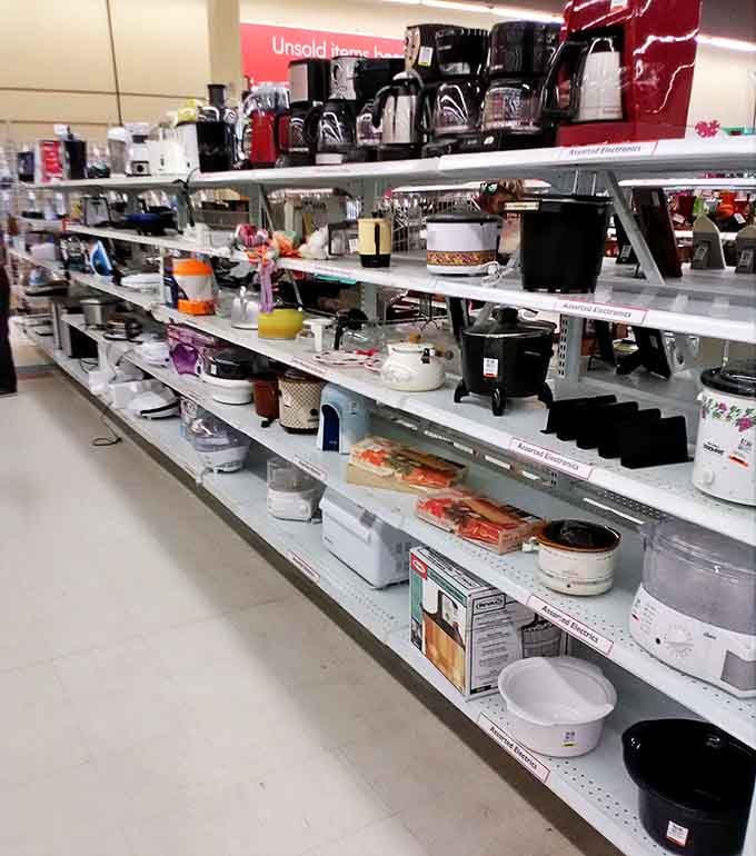 The small appliance graveyard, where coffee makers and slow cookers get their second chance. That waffle iron was probably used exactly twice.