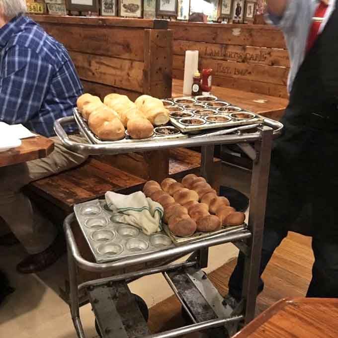 Fresh rolls stacked on carts like edible ammunition, ready to fly across the dining room any second.