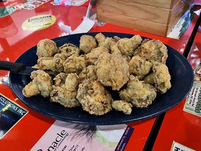 Fried mushrooms piled high enough to make any vegetable-avoider reconsider their life choices and dietary restrictions completely.