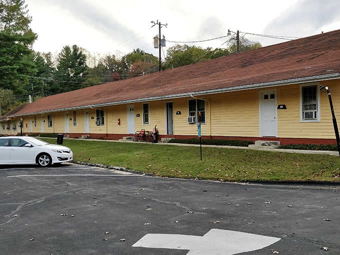 The Lemon Inn's sunny yellow exterior offers a cheerful welcome to weary travelers, promising simple comforts without unnecessary frills.