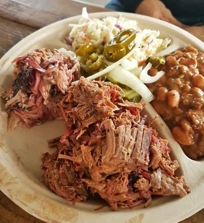 Tender pulled pork piled high with beans and coleslaw makes for one seriously satisfying barbecue plate.