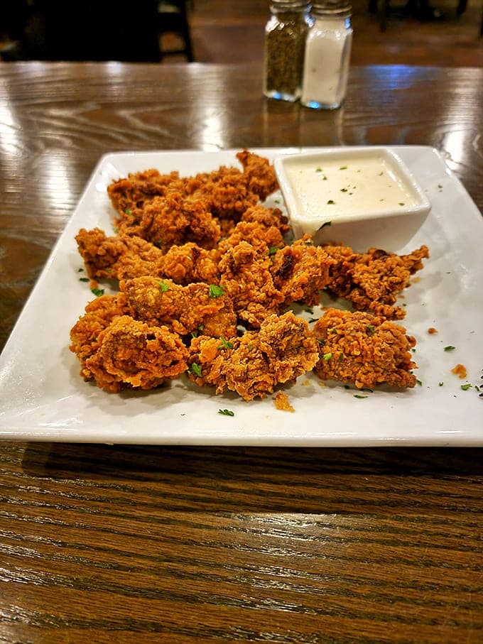 Golden-fried treasures that prove appetizers aren't just opening acts. These crispy morsels with creamy dipping sauce deserve their own standing ovation.