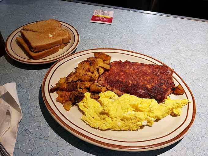 Corned beef hash with eggs and home fries delivers the kind of satisfying breakfast that makes mornings worth experiencing.
