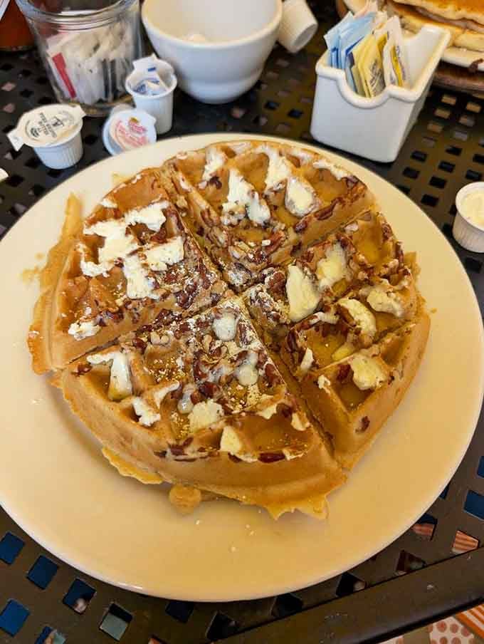 Pecan-studded waffles with whipped cream that make you wonder why anyone ever settled for plain breakfast carbs in their life.