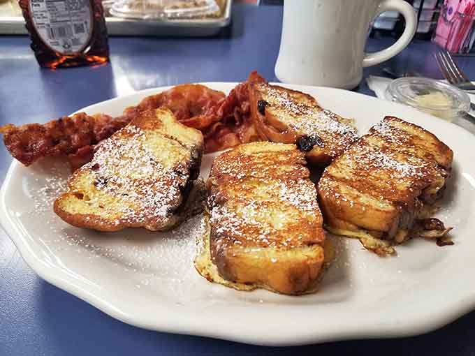 French toast dusted with powdered sugar like fresh snow on the most delicious mountain you'll ever climb.