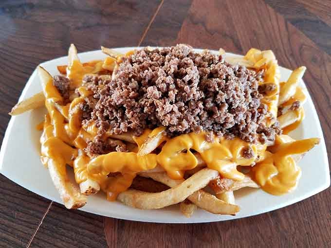 These loaded fries are basically a party on a plate, proving that excess can sometimes be absolutely necessary.