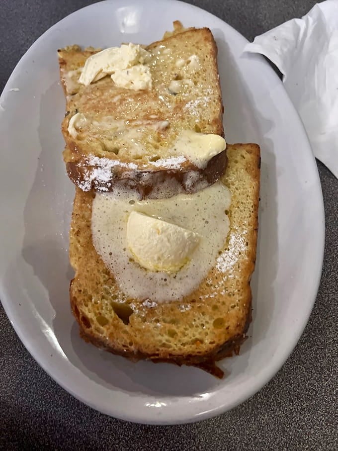 French toast dusted with powdered sugar and topped with butter is basically breakfast dessert, and nobody's complaining about that logic.