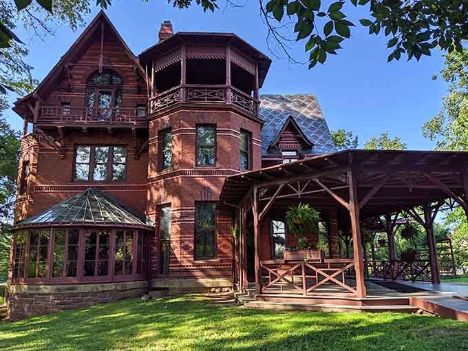The conservatory windows catch sunlight like they're trying to illuminate every brilliant idea Twain ever had in these rooms.