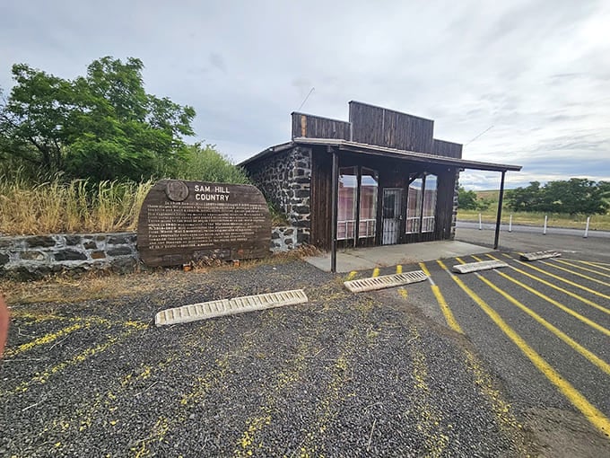 A rustic welcome station greets visitors to this remote corner where Sam Hill's vision became reality.