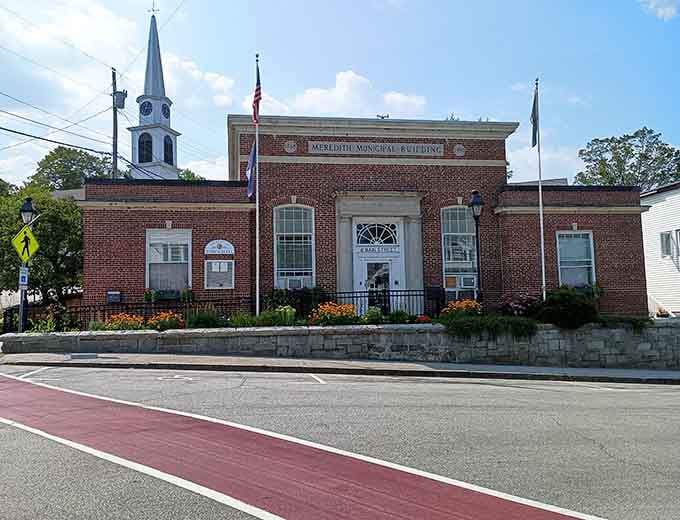 Meredith's Town Hall stands proudly with its brick façade and white trim – civic pride wrapped in architectural elegance.