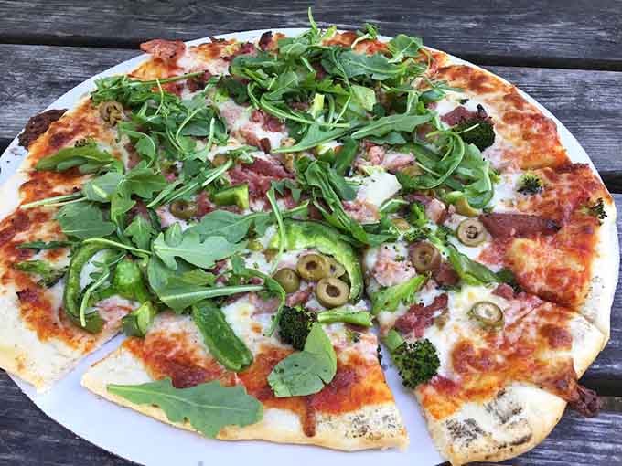 Fresh arugula on pizza proves that healthy and indulgent can absolutely coexist in harmony.