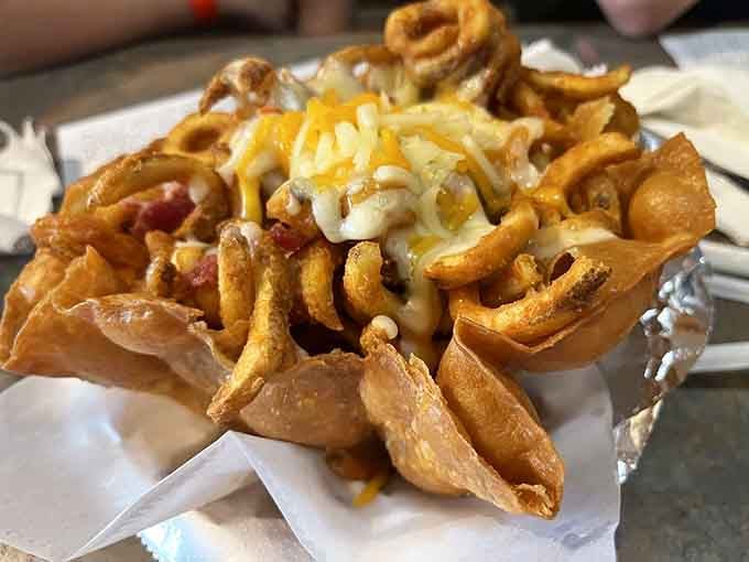 Curly fries topped with cheese and bacon, because sometimes more really is more, isn't it?