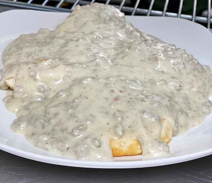 That homemade sausage gravy cascading over biscuits is the kind of sight that makes diets take a vacation day.