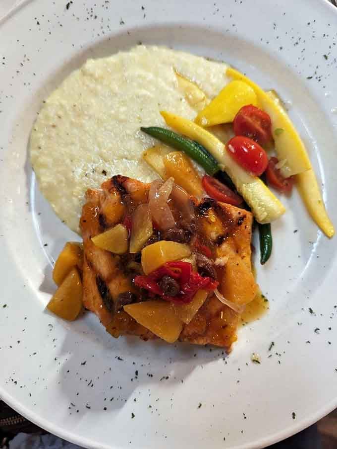 Peach barbecue salmon over stone-ground grits showcases Southern flavors dancing together in perfect harmony on one beautiful plate.