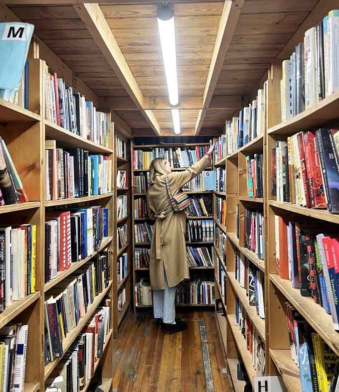 Someone's reaching for their next great read in a space that encourages exploration and happy accidents.