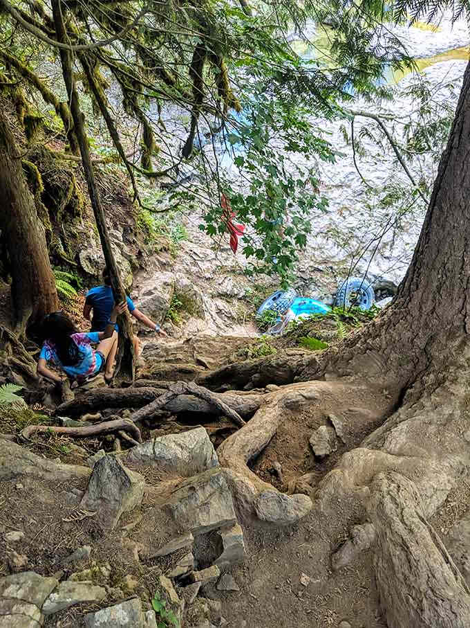 The rocky descent to the water requires careful footing, but adventurers navigate it with the determination of kids heading toward dessert.