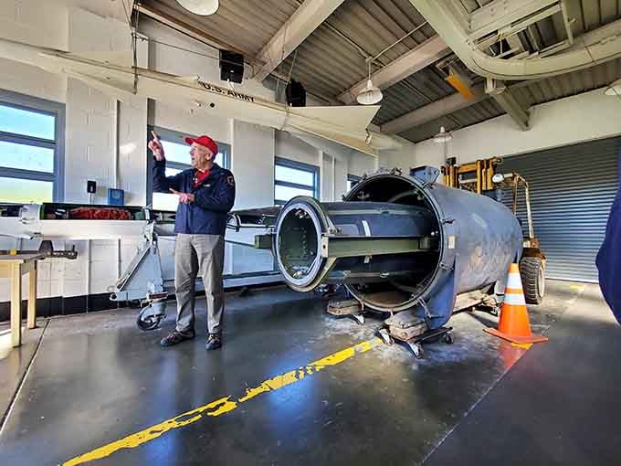 Inside the assembly building, guides explain missile components to visitors who suddenly feel very small and very mortal.