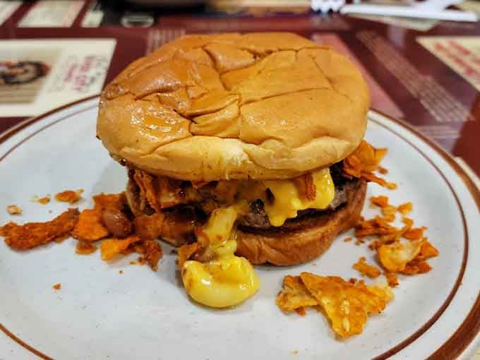 This isn't your average burger; it's a melted cheese masterpiece with crispy onion rings.