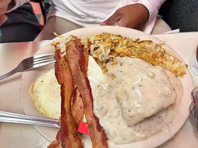 Biscuits drowning in peppery gravy is the kind of comfort food that makes you understand why people write country songs.