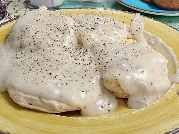 Biscuits drowning in creamy gravy, the kind of Southern comfort that makes you understand why people write songs about home.