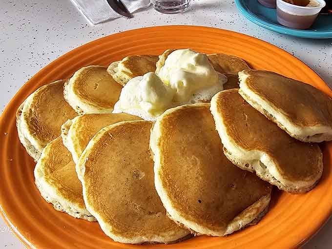 Pancakes that don't just sit on the plate&mdash;they command it. With two scoops of butter slowly melting into golden pools of breakfast bliss.