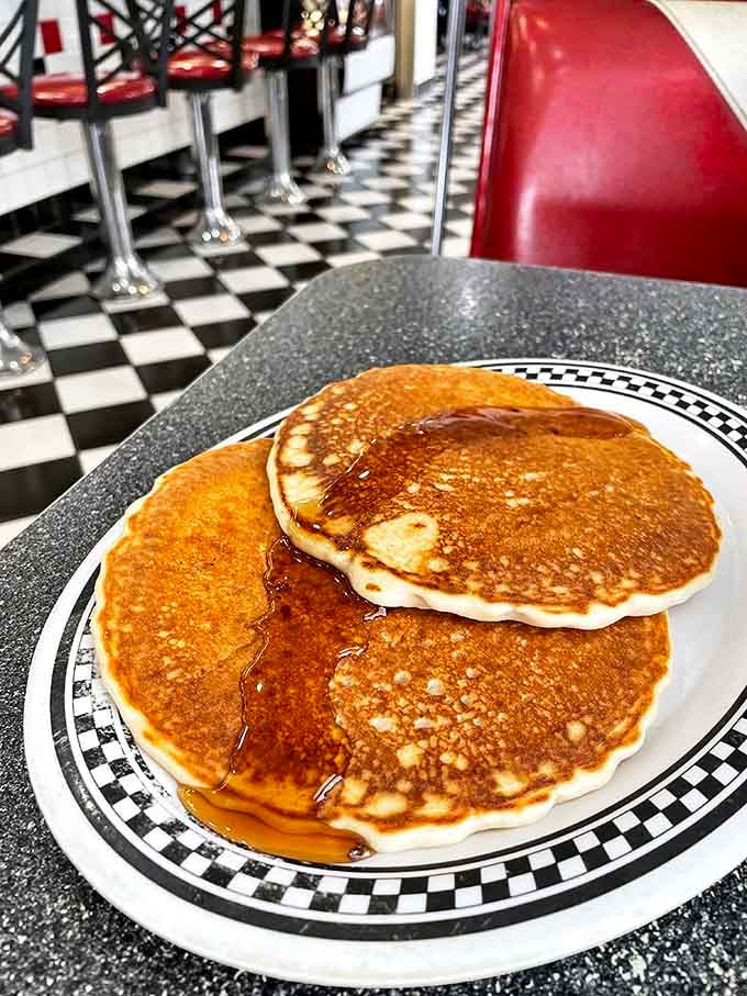 Golden pancakes catching the light like they know they're photogenic. That perfect syrup-to-pancake ratio is what breakfast dreams are made of.